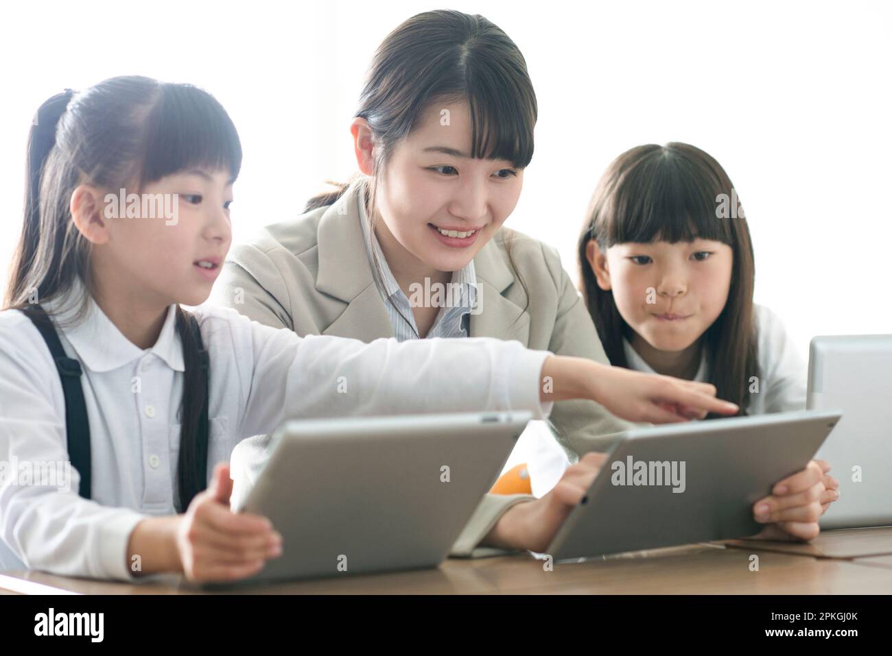 Teacher Teaching Programming to Elementary School Students AR Stock ...