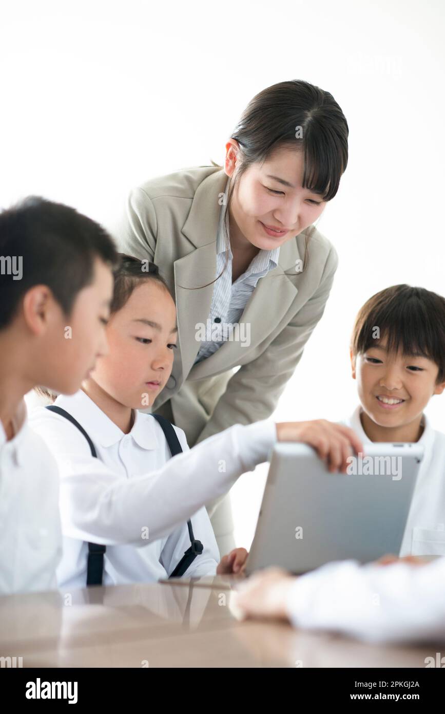 School uniform girl and boy stand hi-res stock photography and images ...