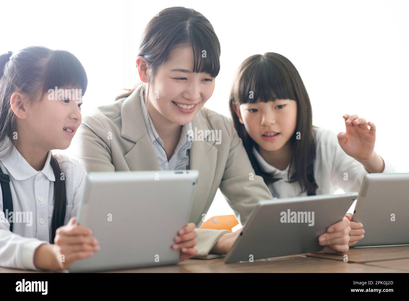 Teacher Teaching Programming to Elementary School Students AR Stock ...