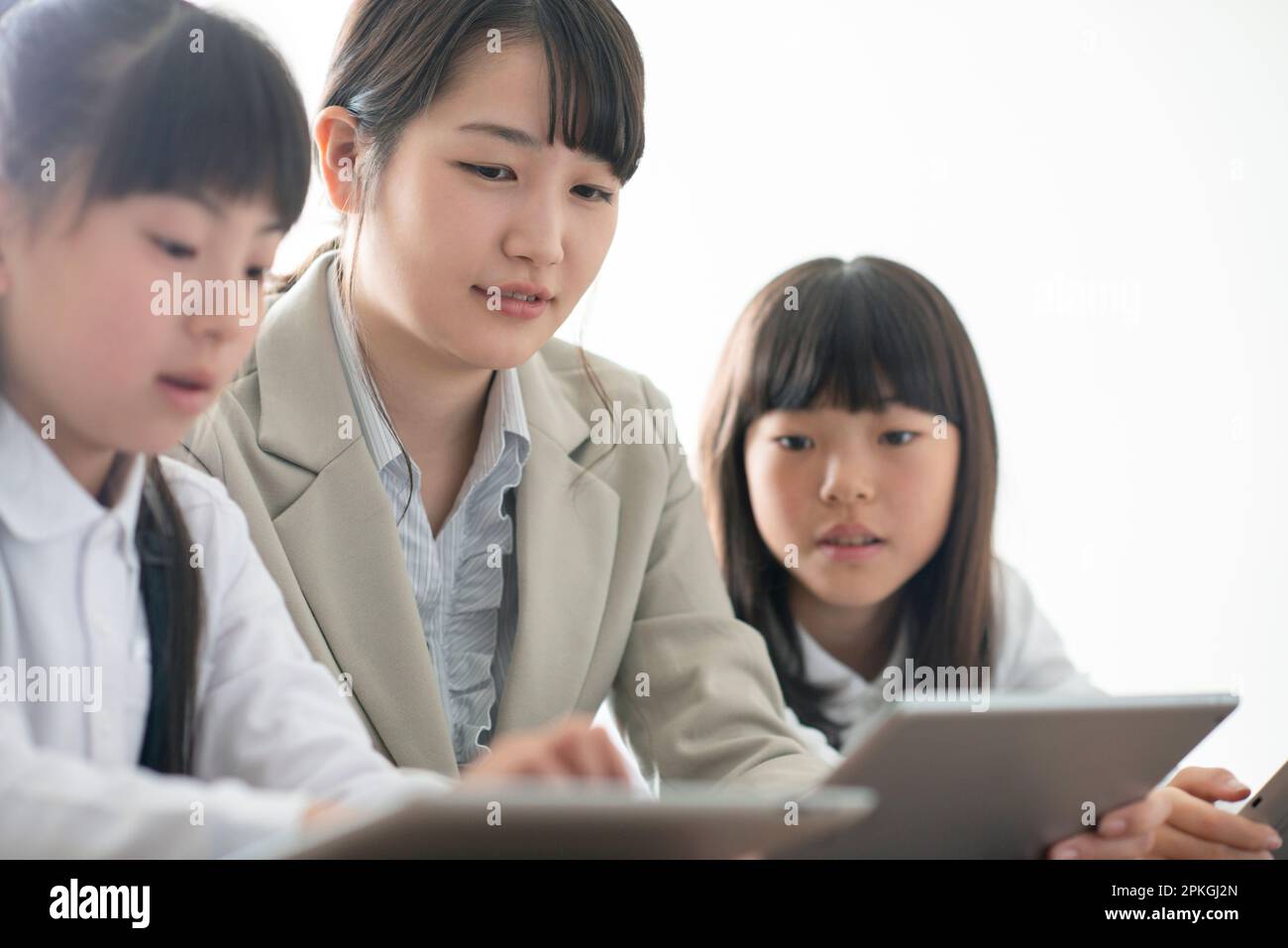 Teacher Teaching Programming to Elementary School Students AR Stock ...