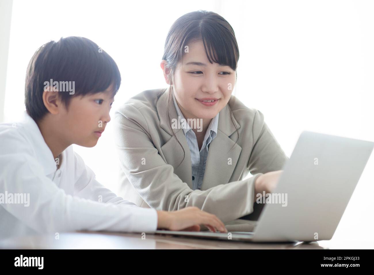 An Elementary School Student Teaching Programming to a Teacher AR Stock ...