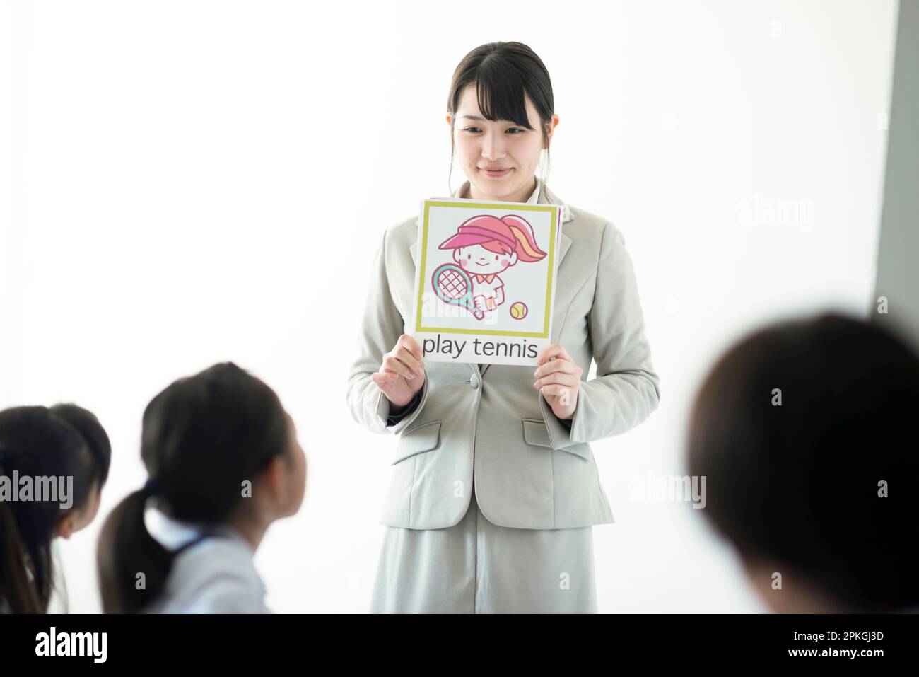 Teacher who teaches English to elementary school students Stock Photo ...
