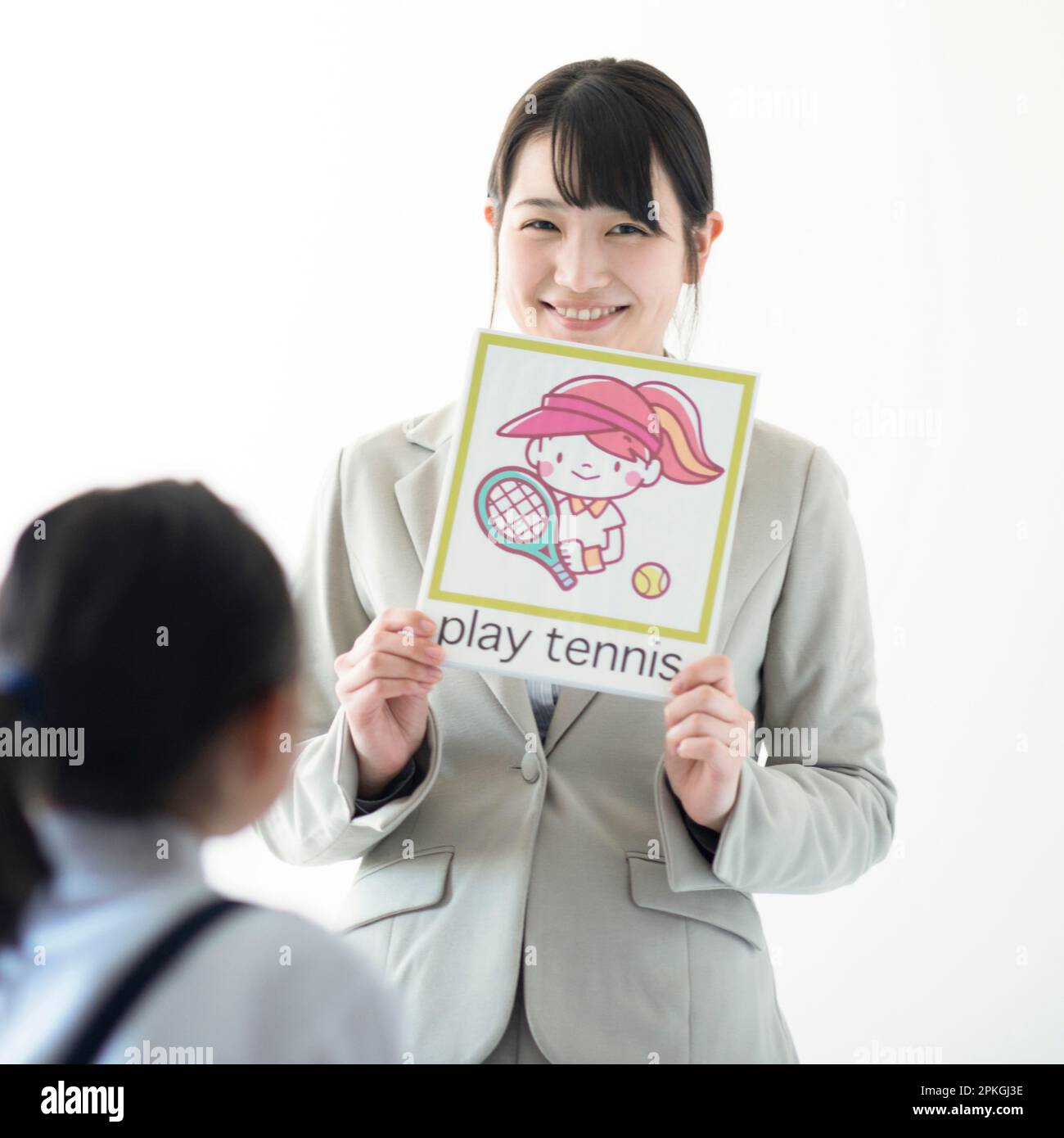 Teacher who teaches English to elementary school students Stock Photo ...