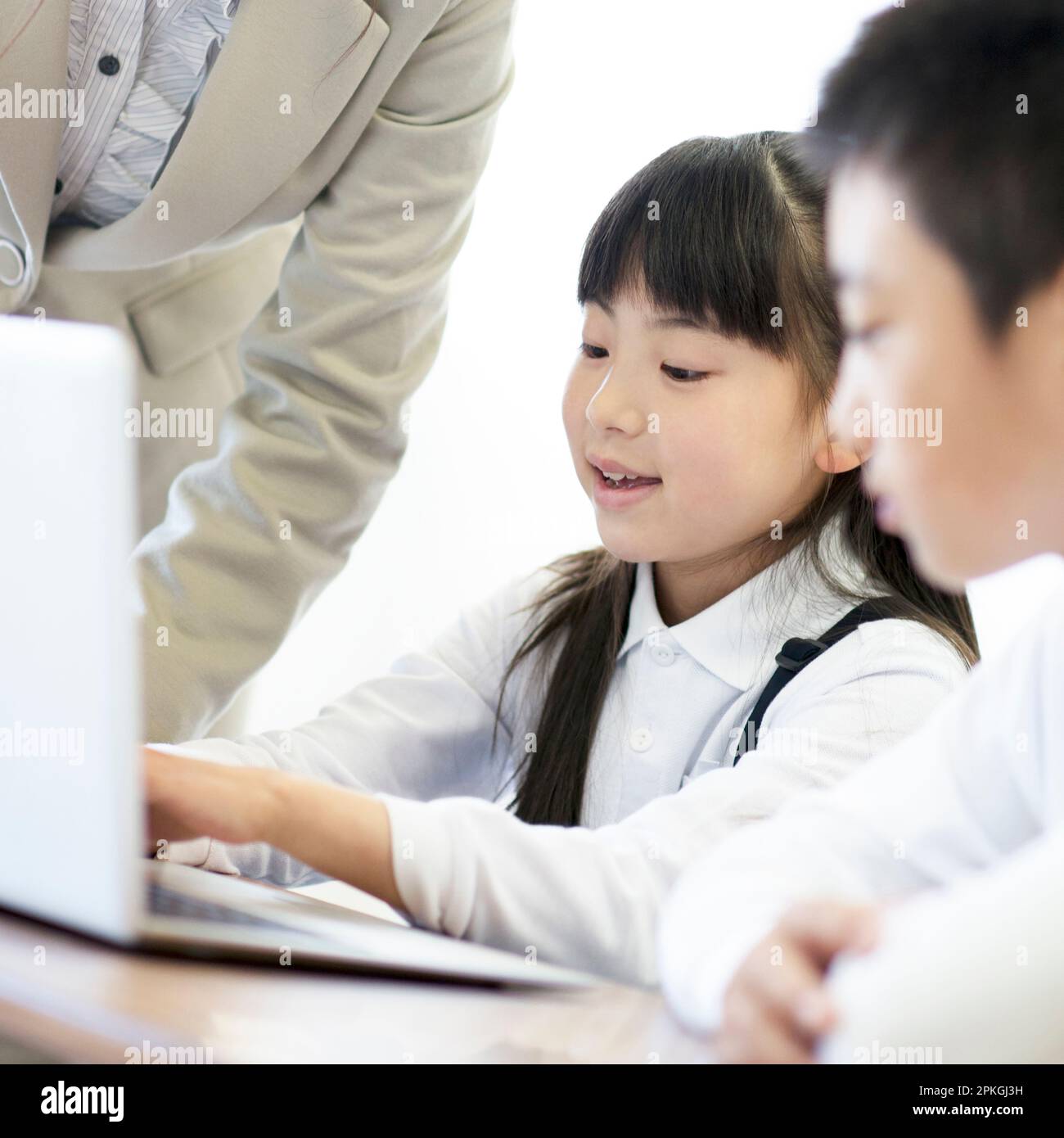 Elementary school students studying programming Stock Photo - Alamy