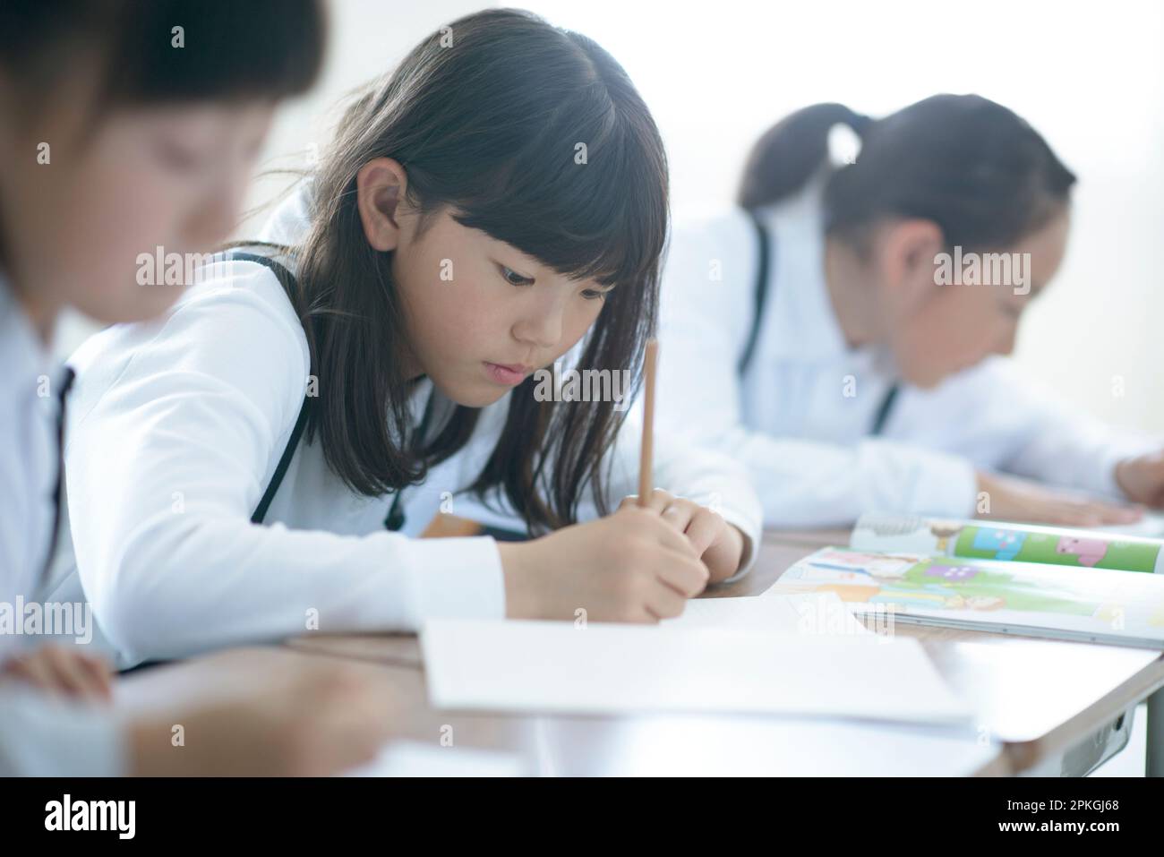 Elementary school students taking a class in a classroom Stock Photo ...