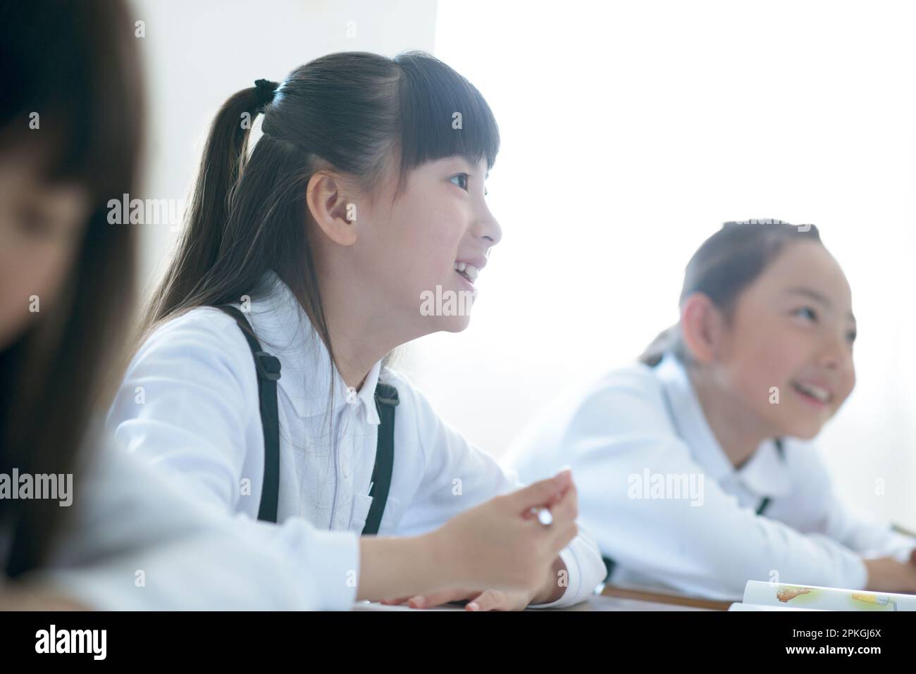 Elementary school students taking a class in a classroom Stock Photo ...