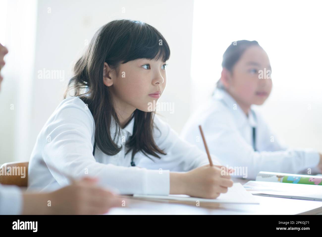 Elementary school students taking a class in a classroom Stock Photo ...