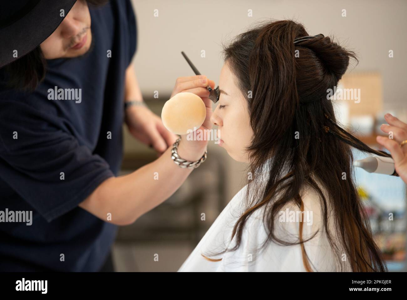 Woman combing hair artist hi-res stock photography and images - Alamy