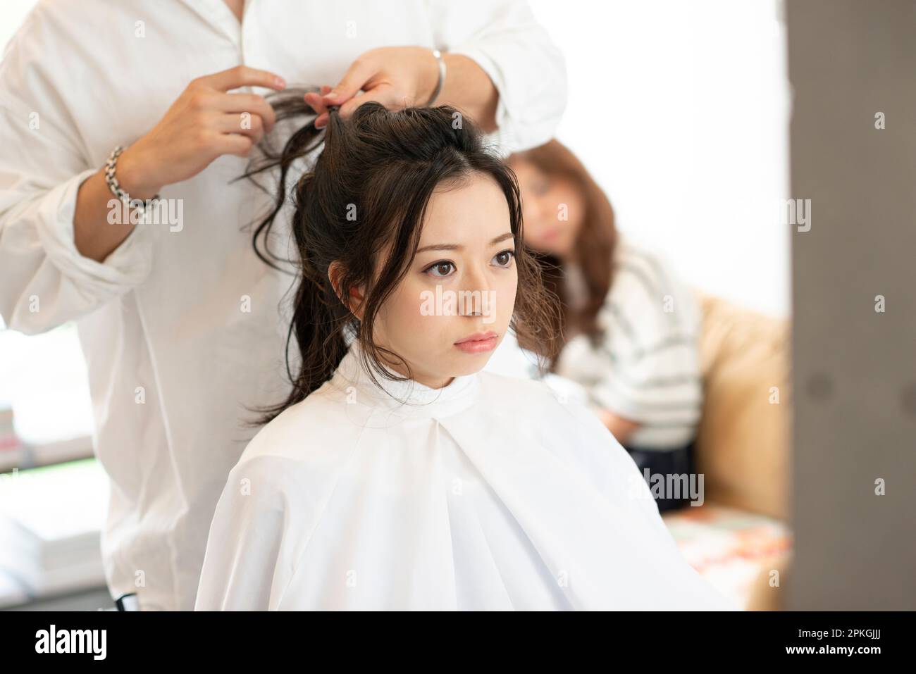 Woman having her hair set by a hairdresser Stock Photo - Alamy