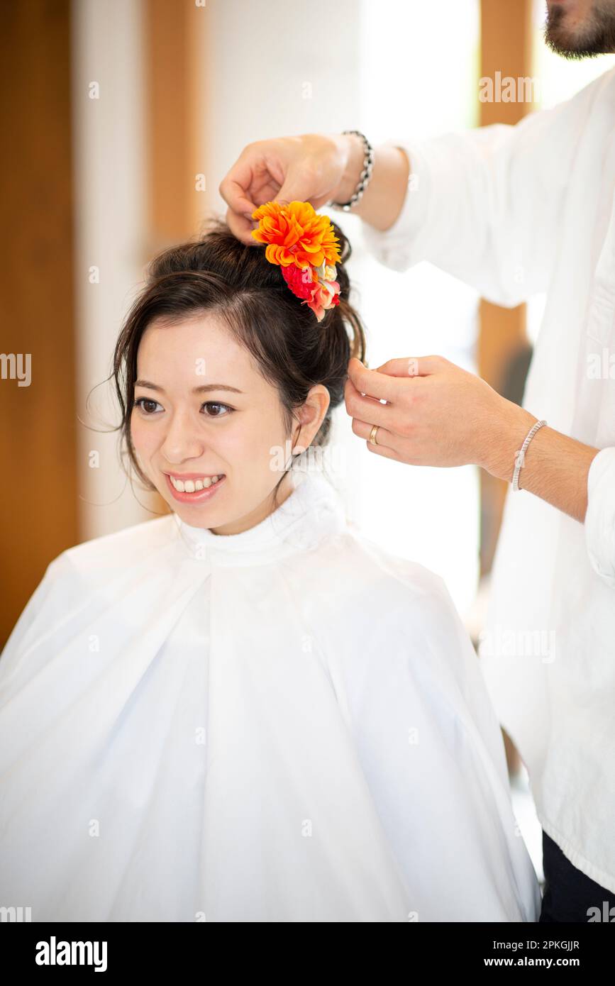 Woman having her hair set by a beautician Stock Photo - Alamy