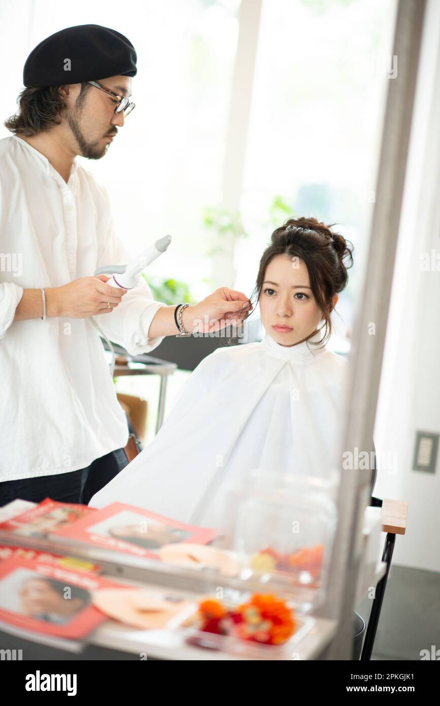 Woman with hair up curl hi-res stock photography and images - Alamy