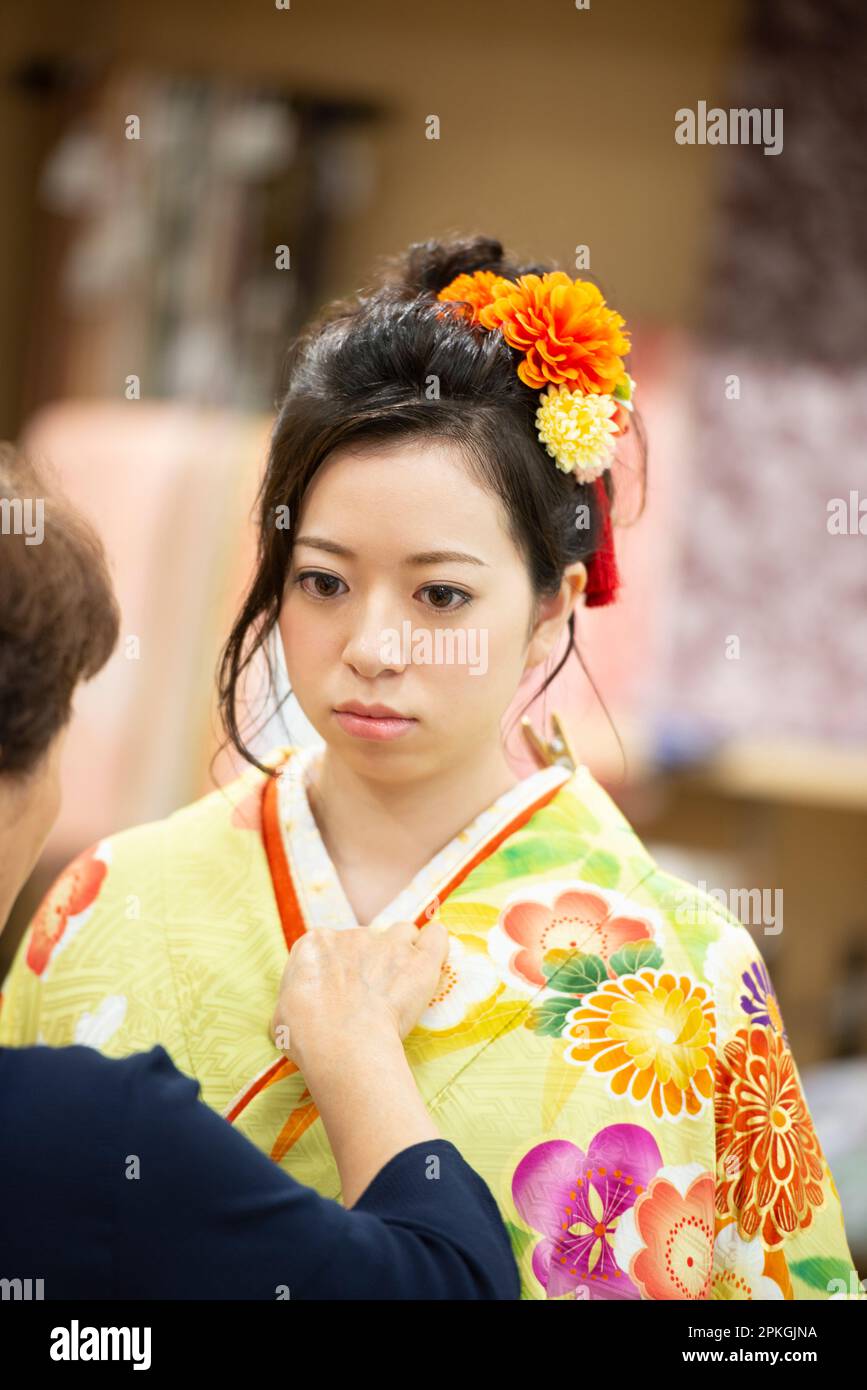 Woman getting dressed Stock Photo - Alamy