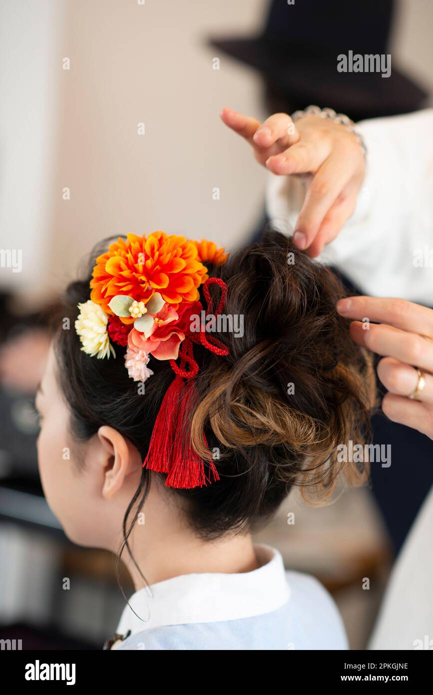 Woman having her hair set by a beautician Stock Photo - Alamy