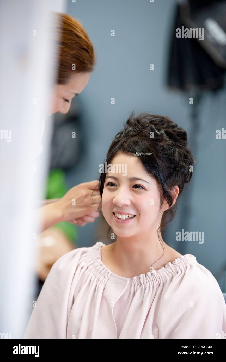 Woman getting makeup done Stock Photo - Alamy