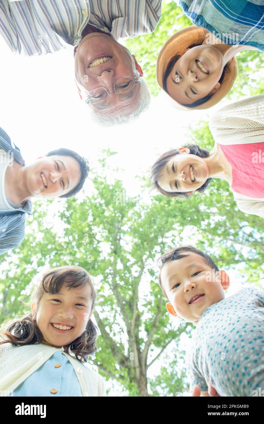 Smiling family of three generations Stock Photo - Alamy