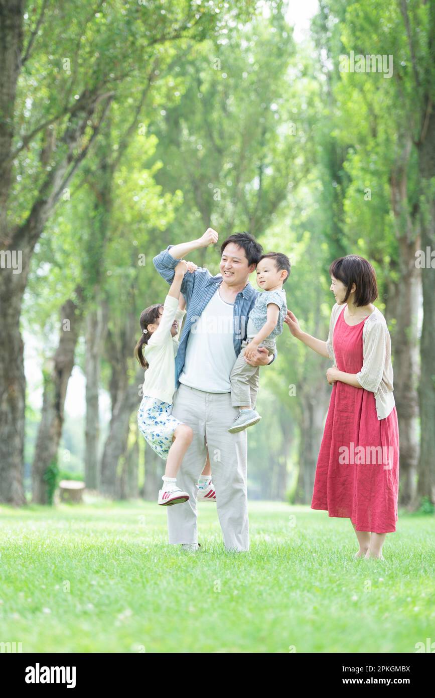 Parent and child playing in a row of poplar trees Stock Photo - Alamy Parent and child playing in a row of poplar trees Stock Photo - Alamy