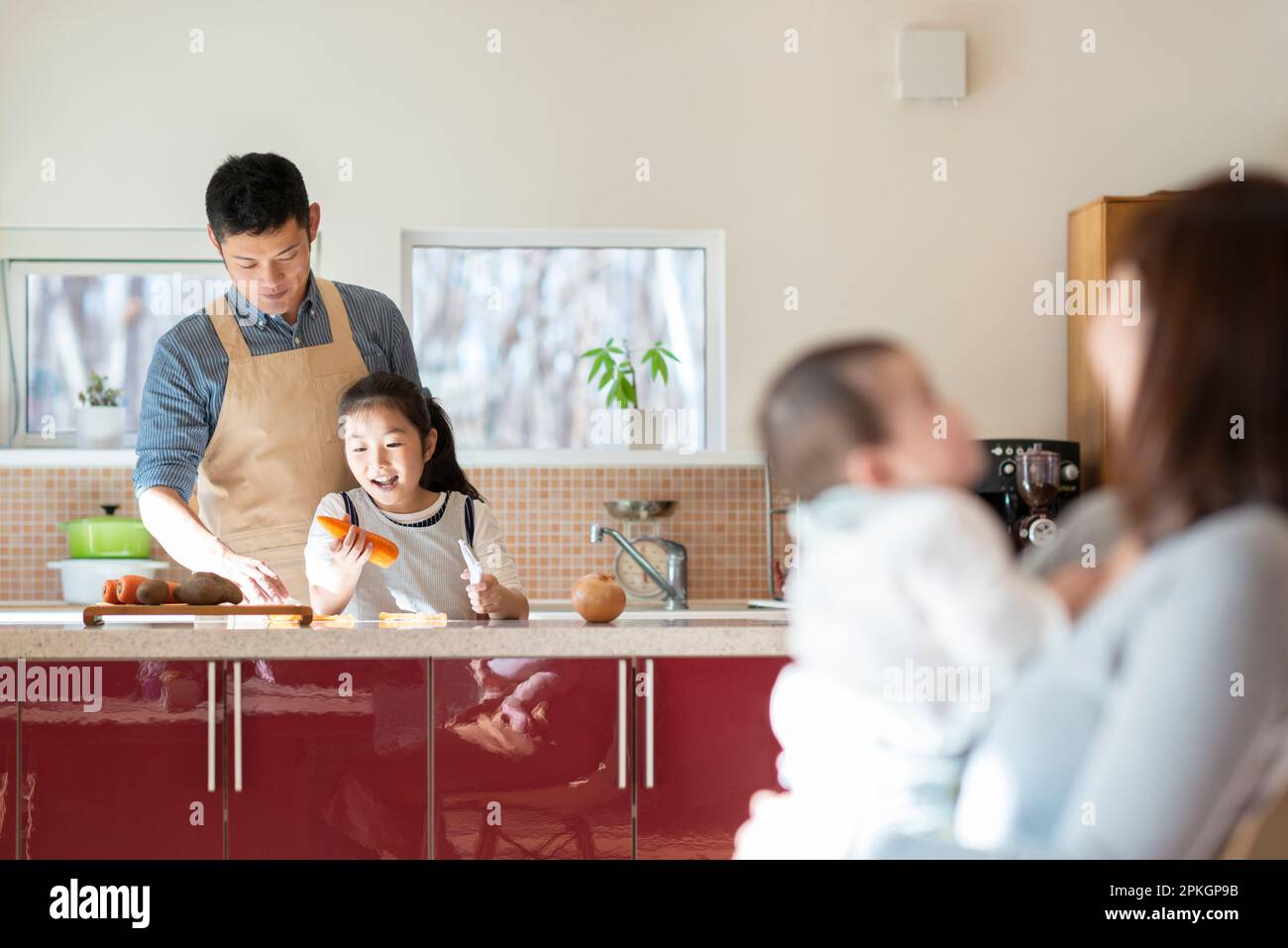 Parent and child cooking in kitchen Stock Photo - Alamy