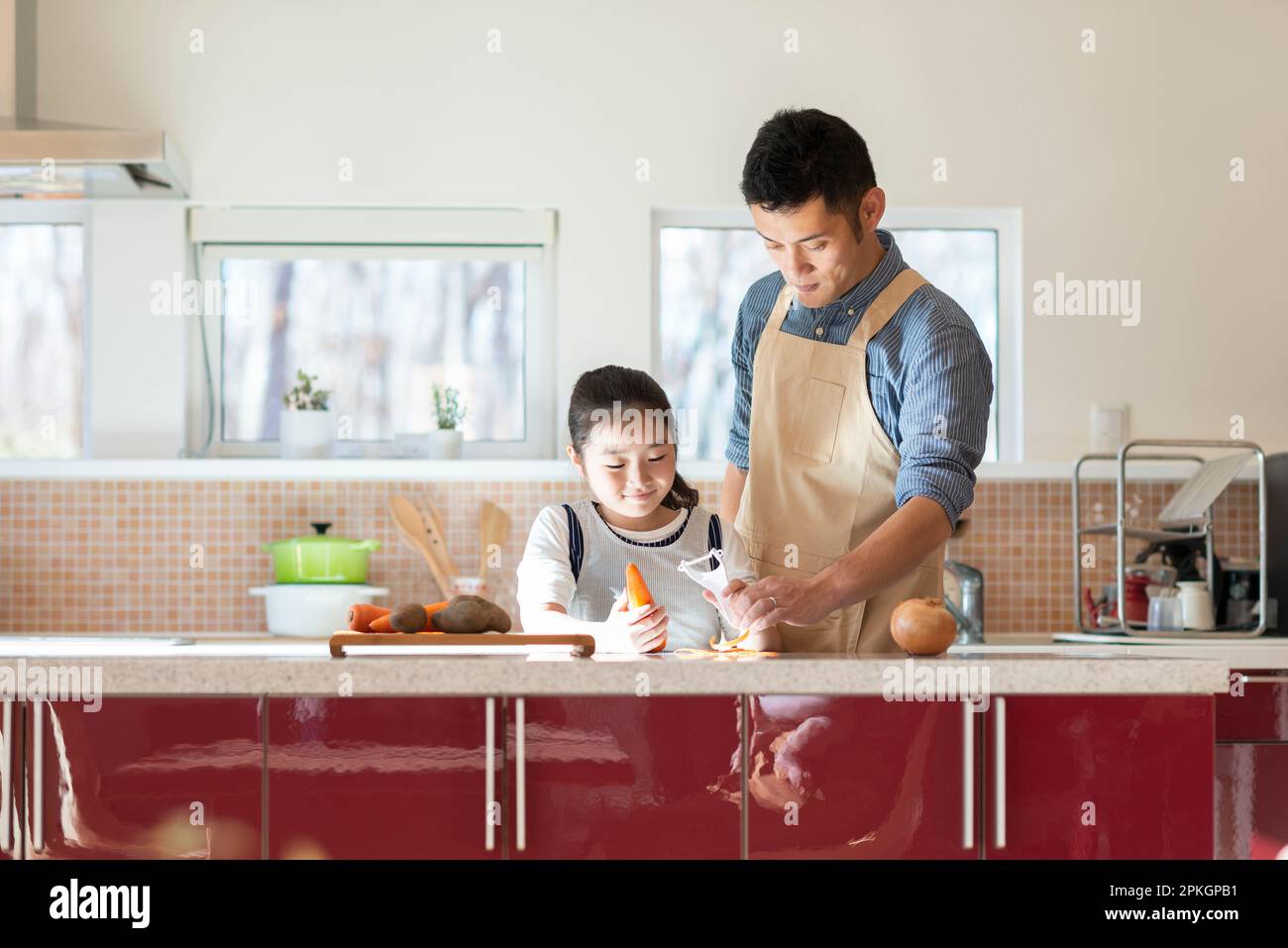 Parent and child cooking in kitchen Stock Photo - Alamy