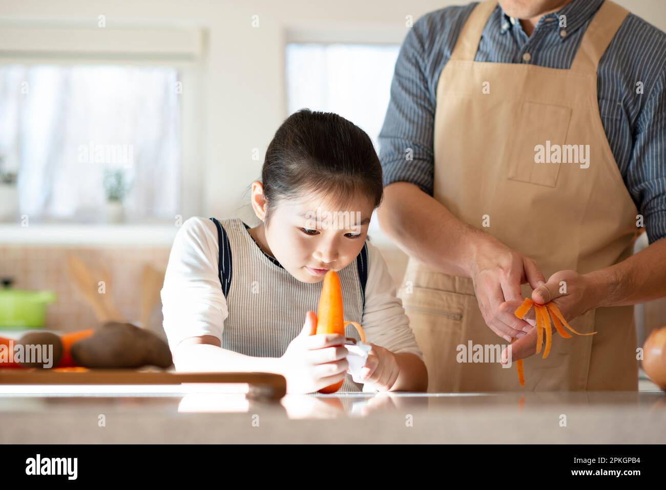 Parent and child cooking in the kitchen Stock Photo - Alamy
