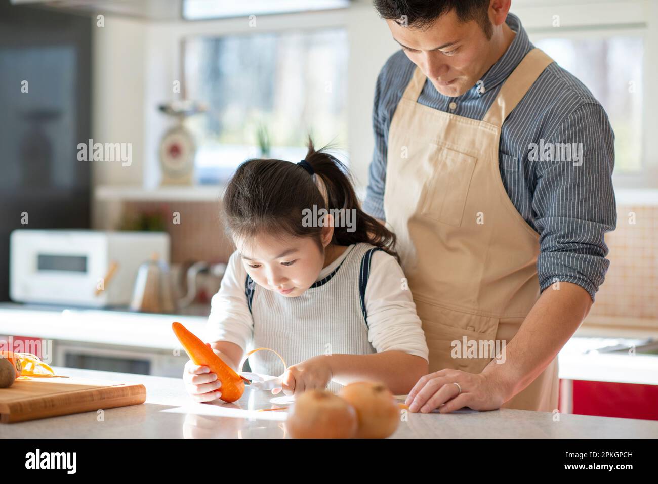 Parent and child cooking in the kitchen Stock Photo - Alamy