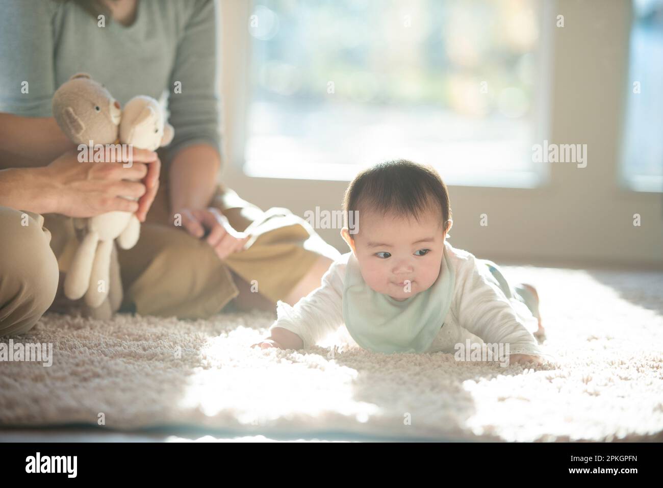 Baby cuddling bear hi-res stock photography and images - Alamy