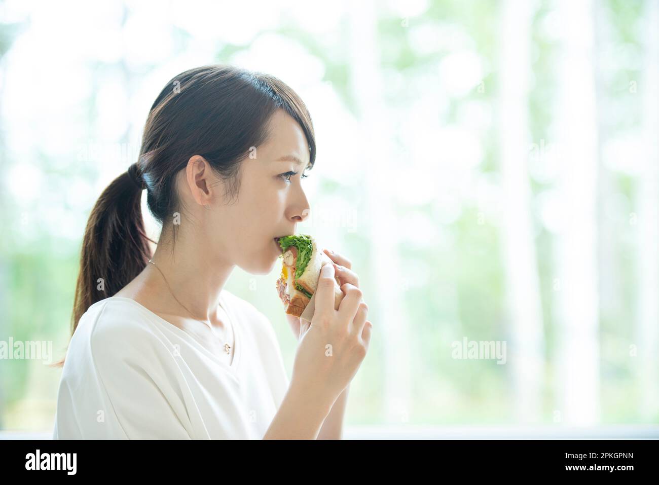 Woman Eating Sandwich Stock Photo - Alamy