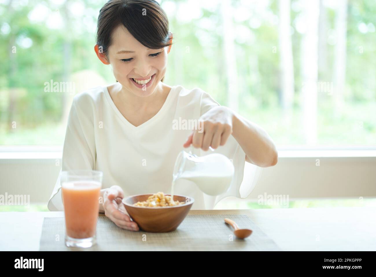 Woman pouring milk on hi-res stock photography and images - Alamy