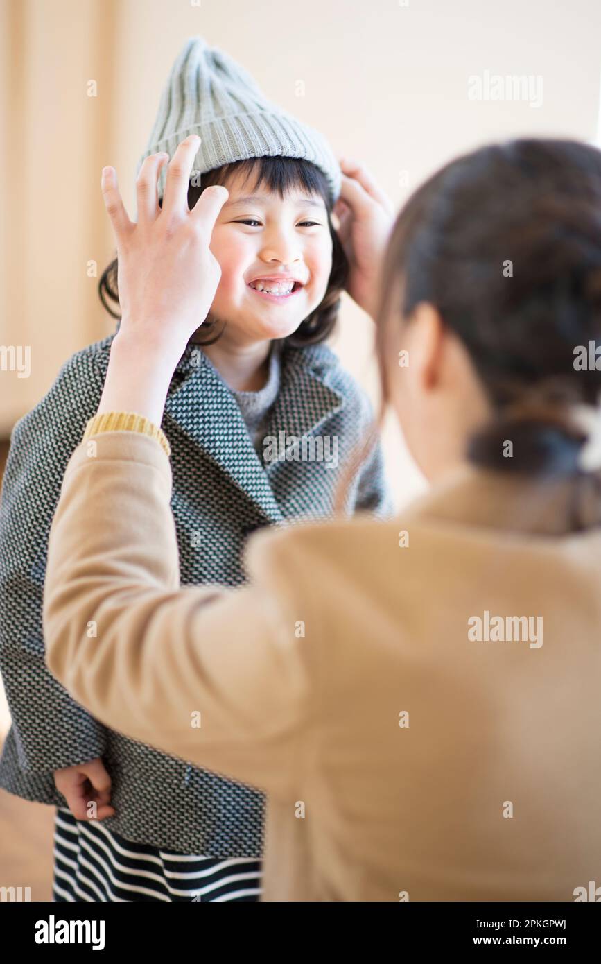 Mother getting ready for her child Stock Photo - Alamy