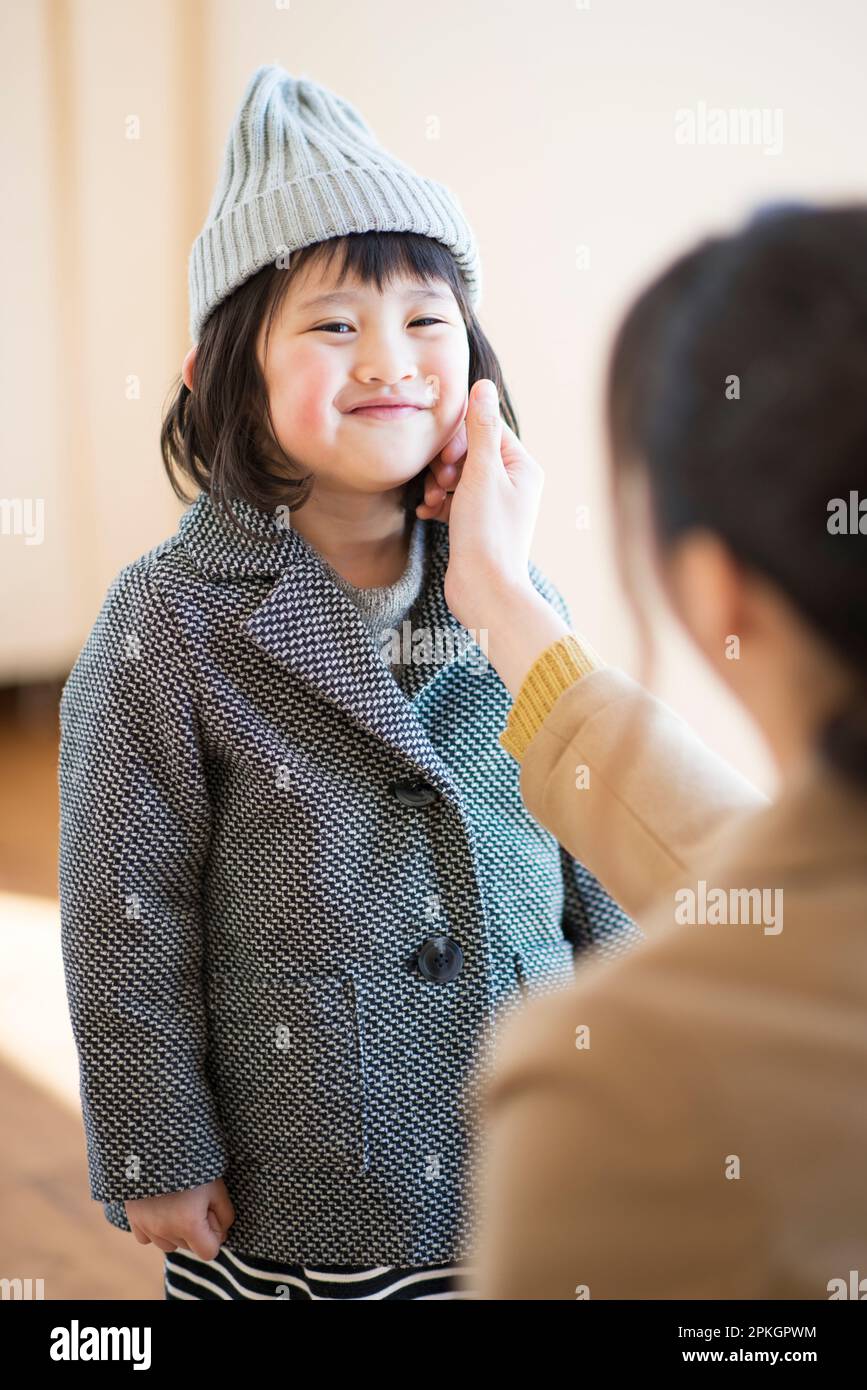 Mother getting ready for her child Stock Photo - Alamy