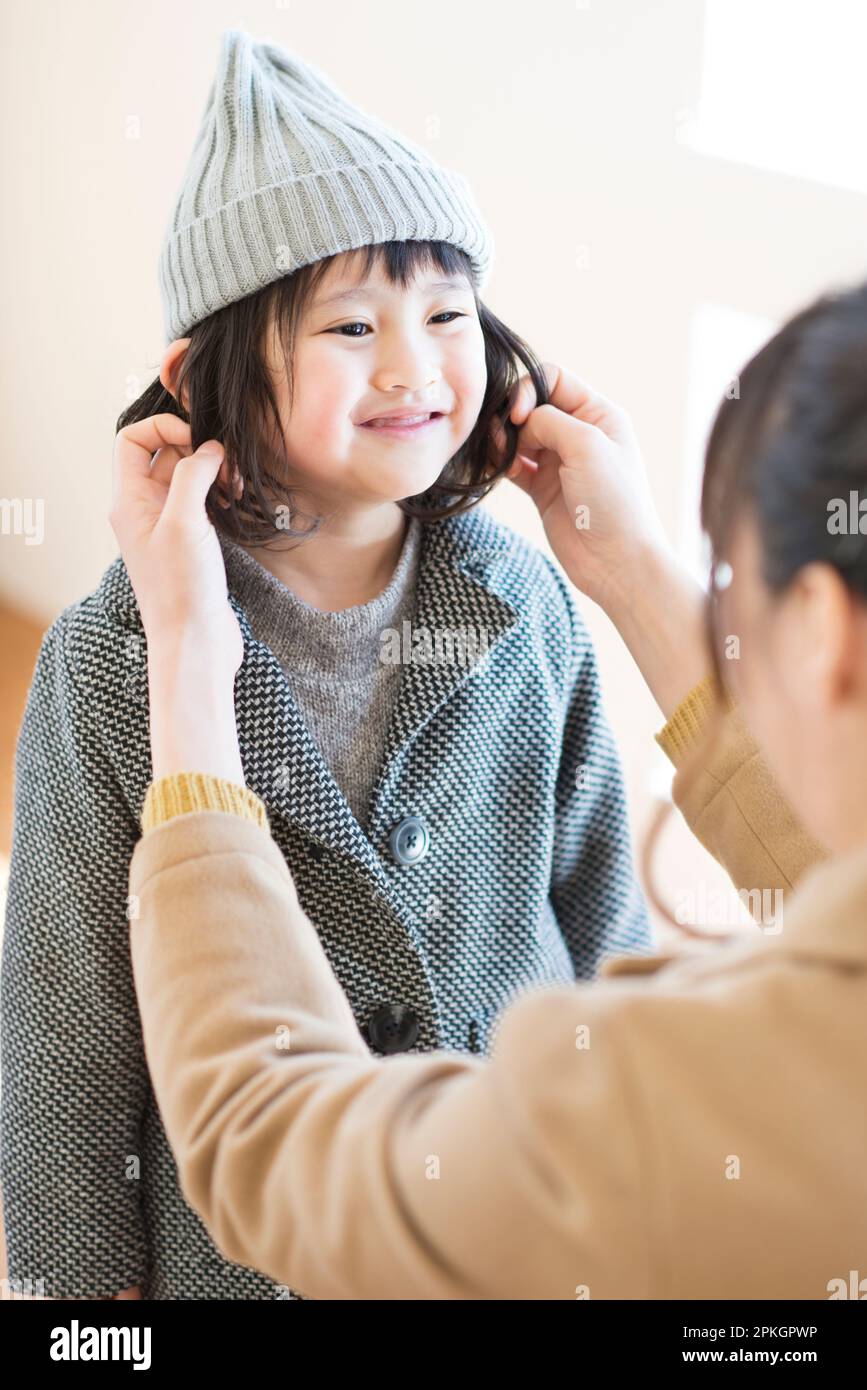 Mother getting ready for her child Stock Photo - Alamy