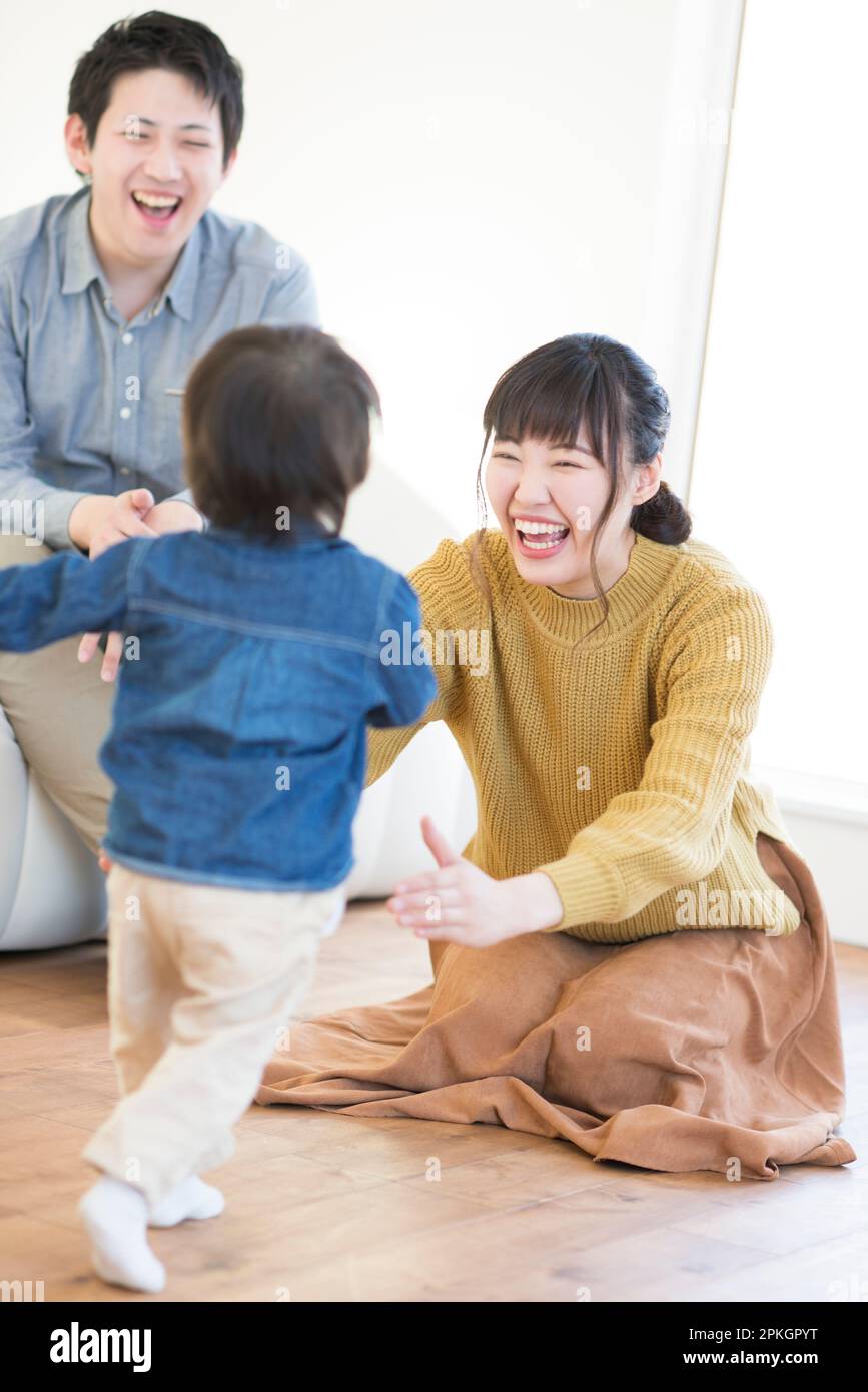 Boy rushing to his parents Stock Photo - Alamy