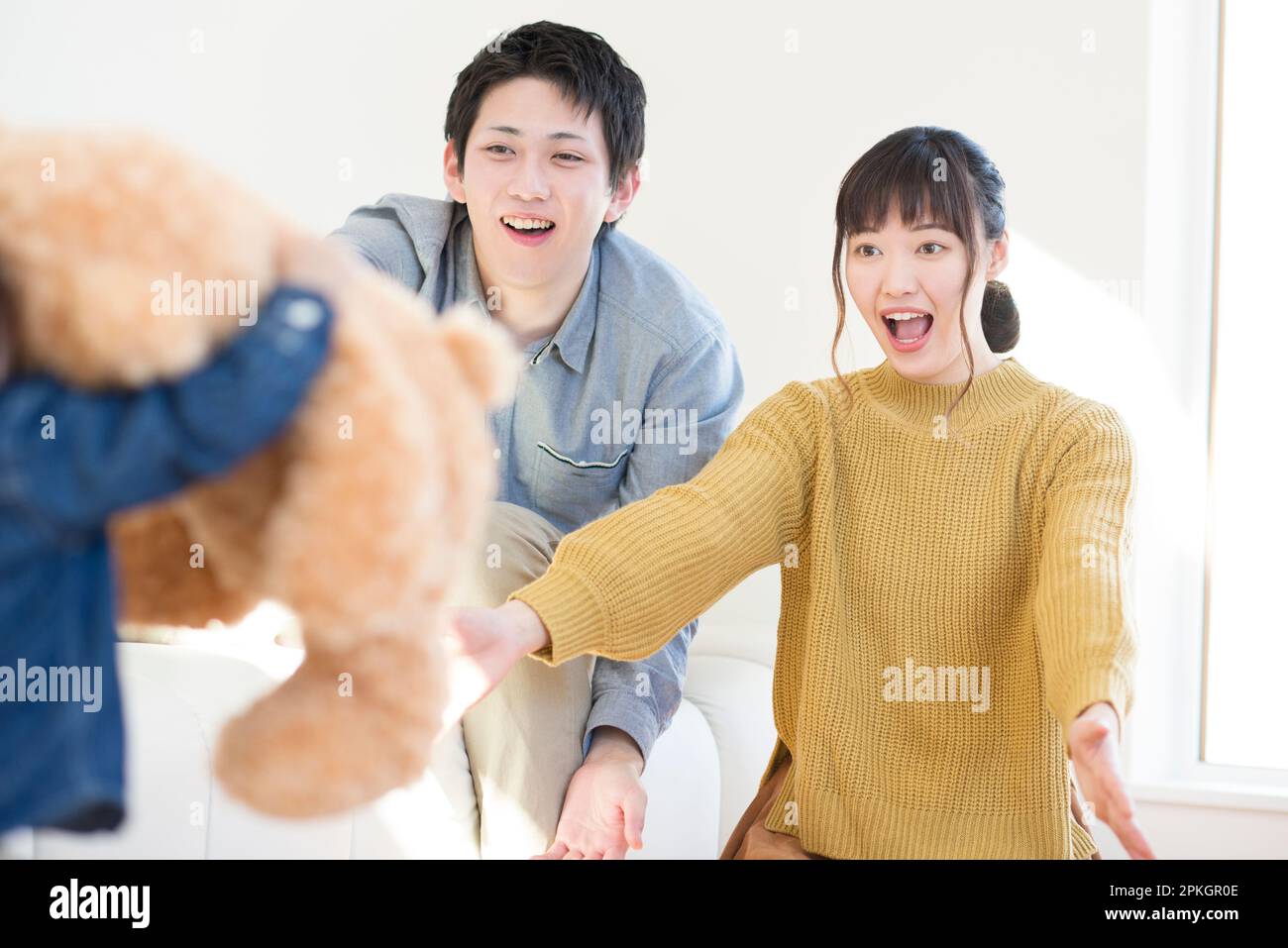 Parents Calling Their Child Stock Photo - Alamy