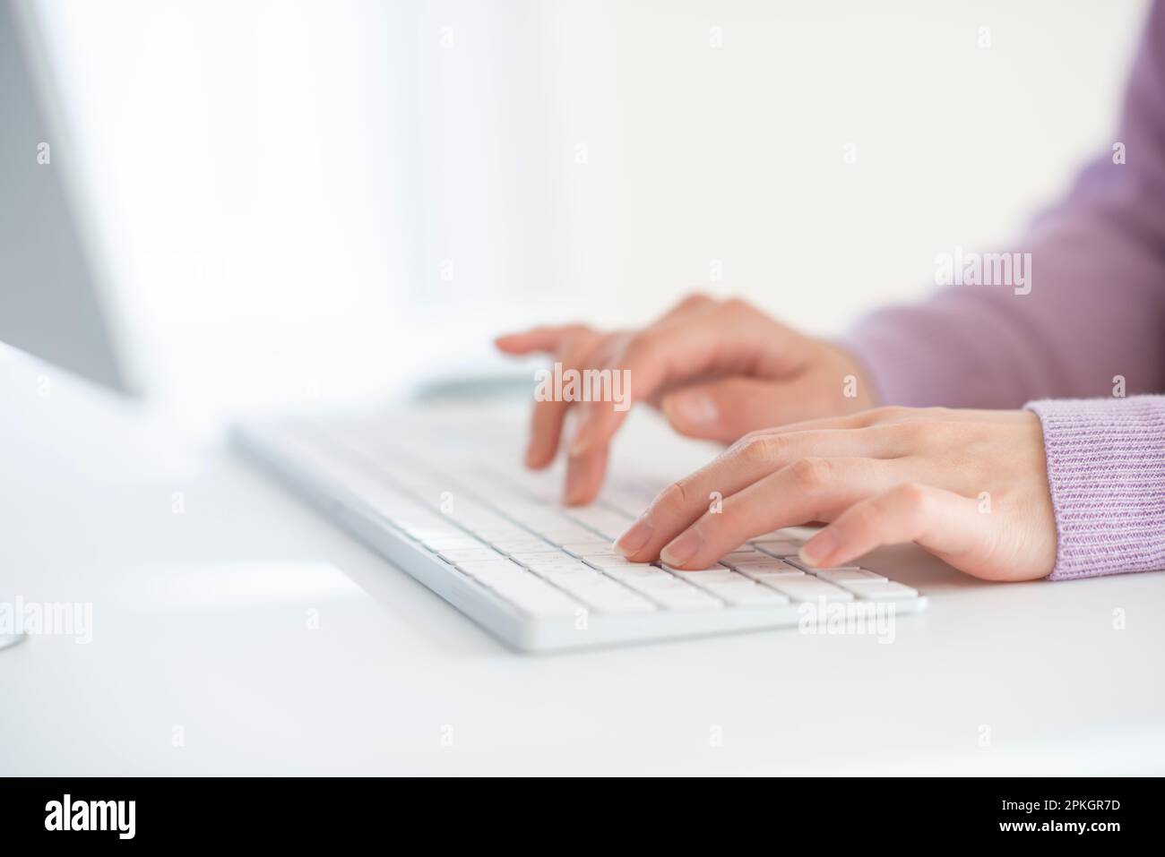 Woman's hand operating computer Stock Photo - Alamy