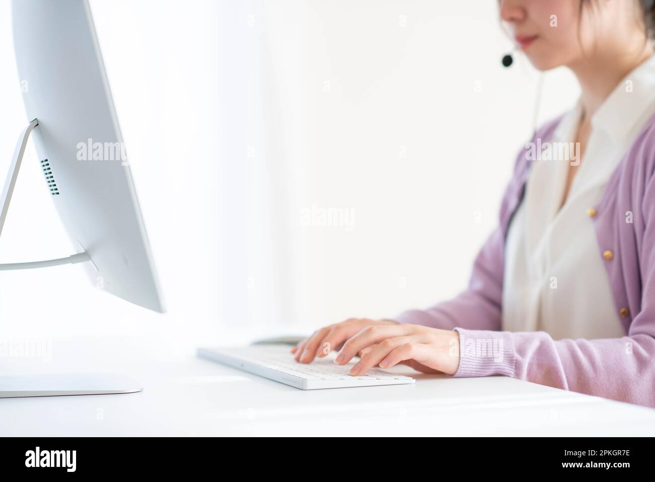 Woman's hand operating computer Stock Photo - Alamy