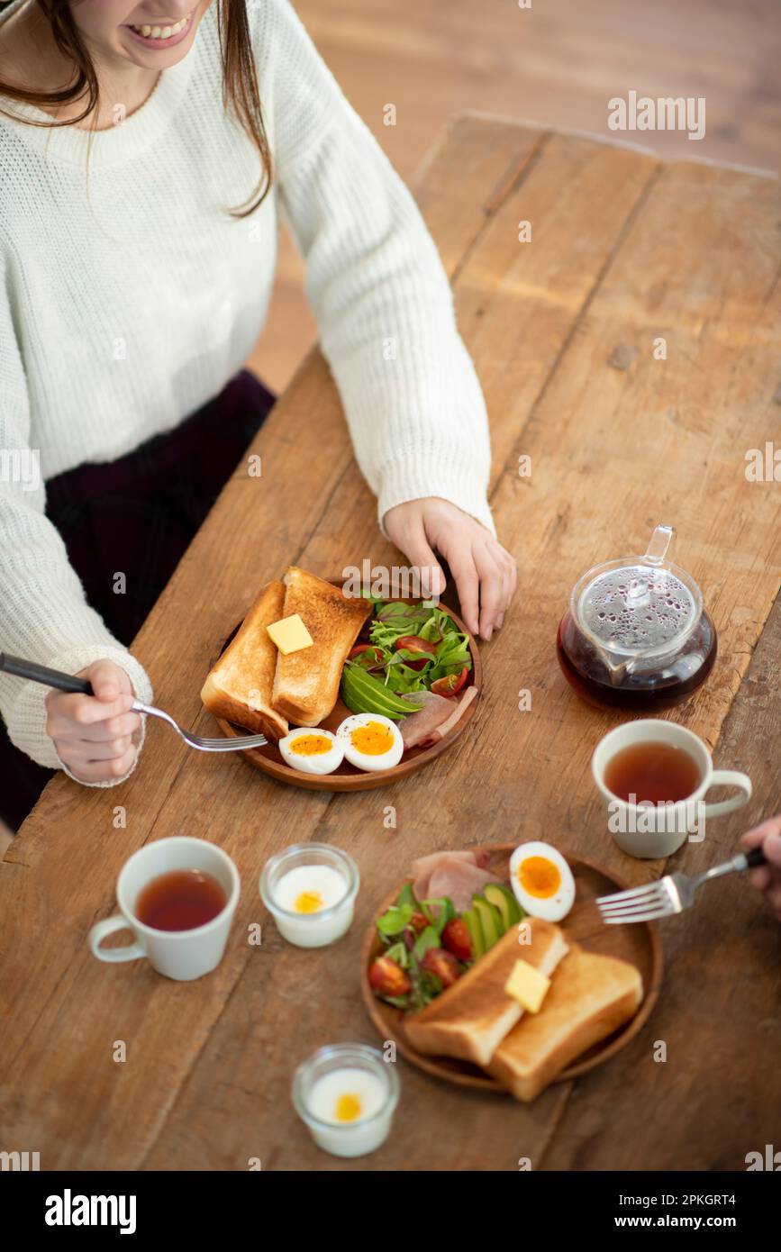 Women eating boiled egg hi-res stock photography and images - Alamy
