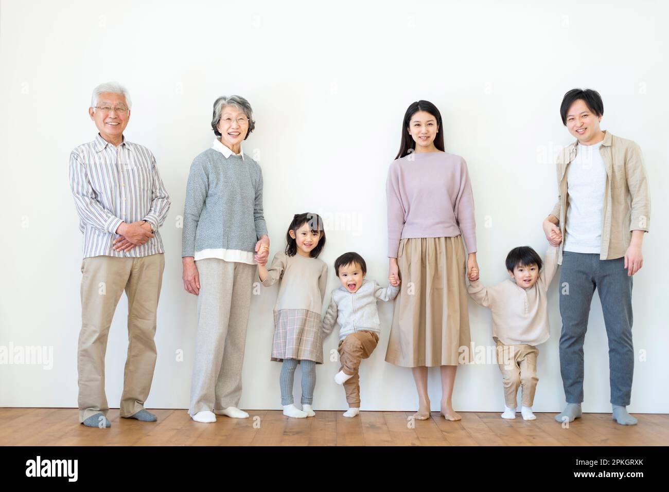 Smiling family of three generations Stock Photo - Alamy