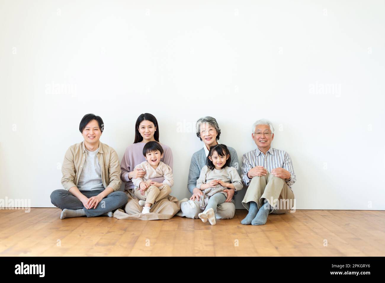 Smiling family of 3 generations Stock Photo - Alamy