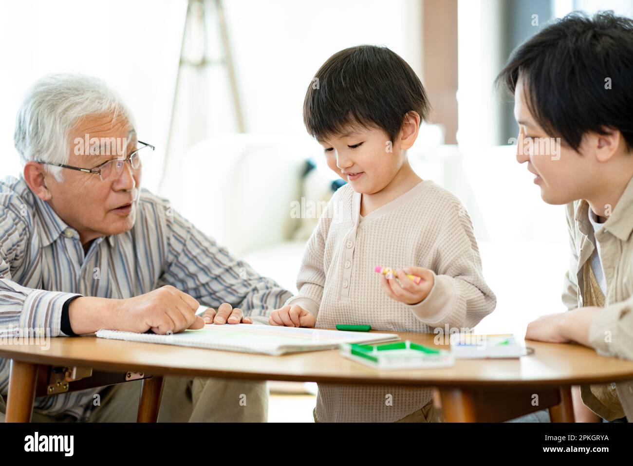 Family of 3 generations painting Stock Photo - Alamy