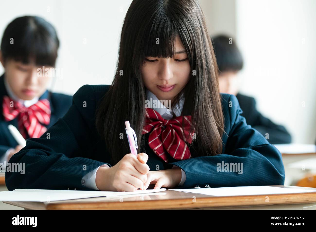 Female students taking a class in a classroom Stock Photo - Alamy