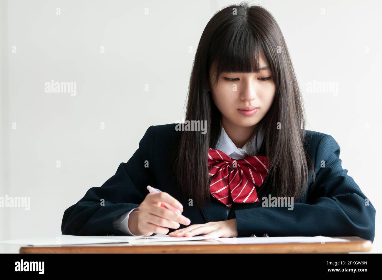 Female students taking a class in a classroom Stock Photo - Alamy
