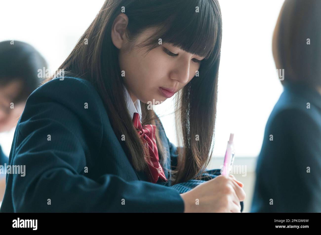 Female students taking a class in a classroom Stock Photo - Alamy