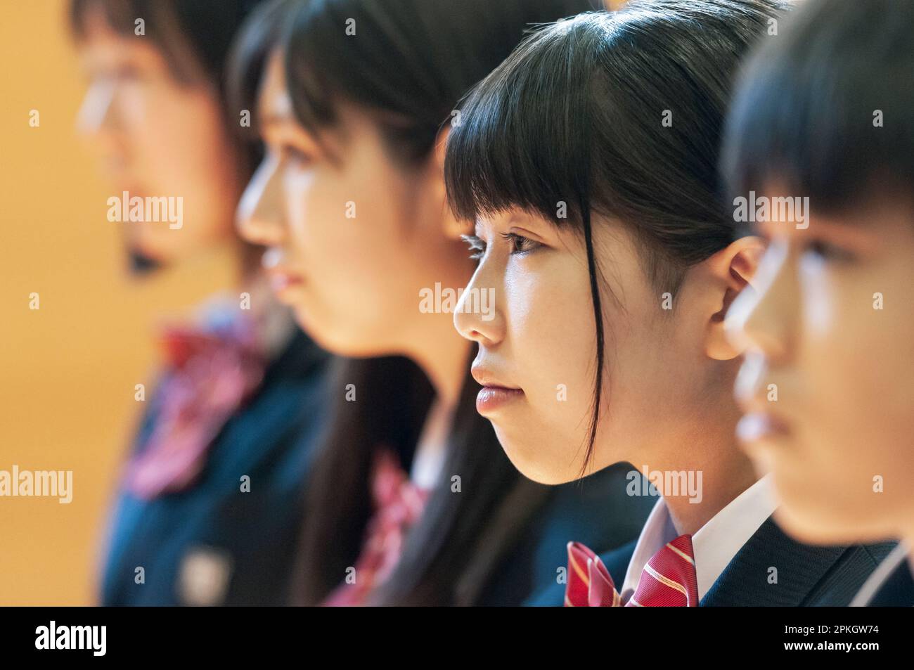 Side view of students lining up in the gymnasium Stock Photo - Alamy