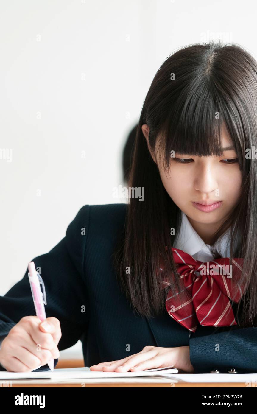 Female students taking a class in a classroom Stock Photo - Alamy