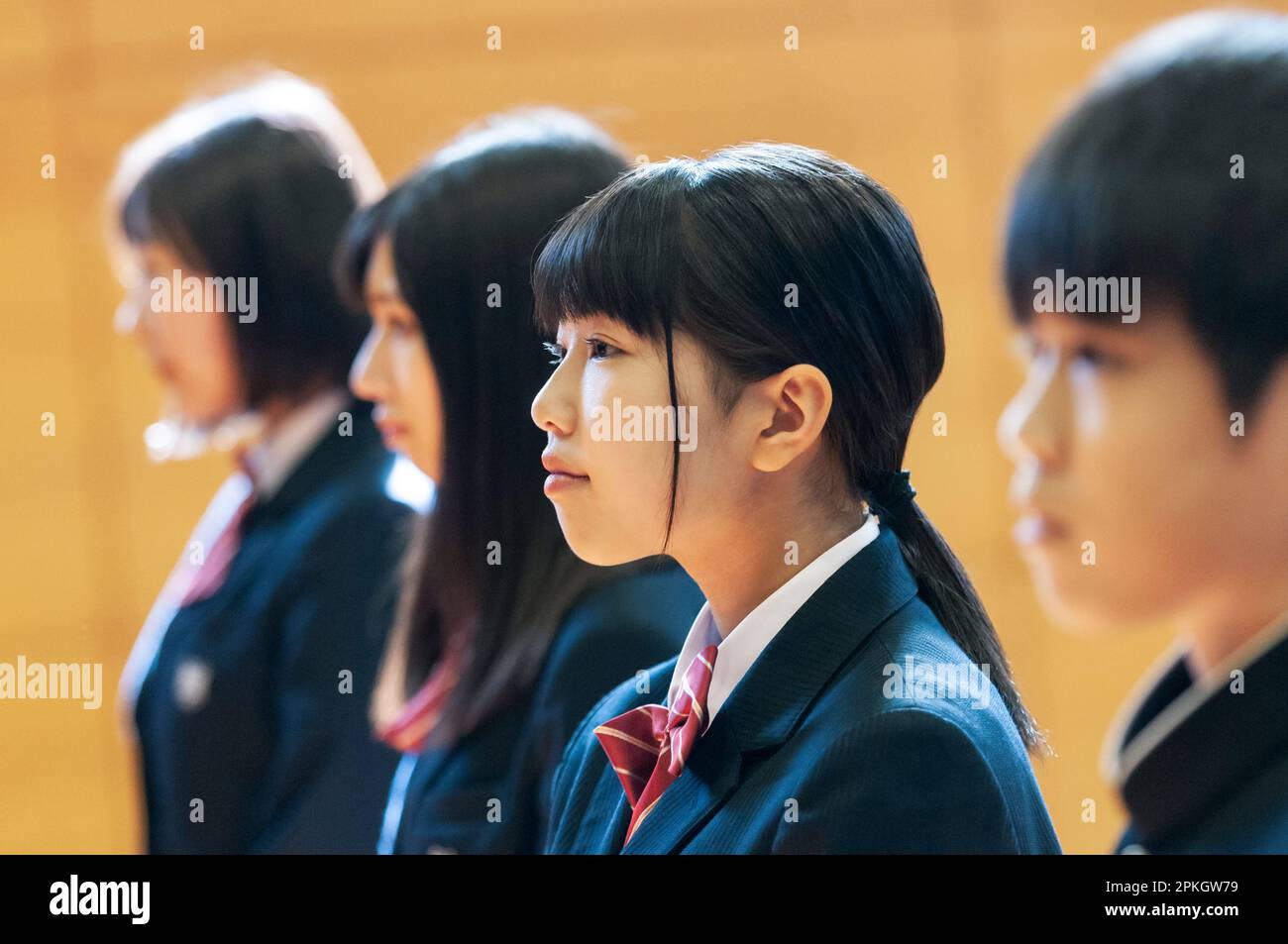 Side view of students lining up in the gymnasium Stock Photo - Alamy
