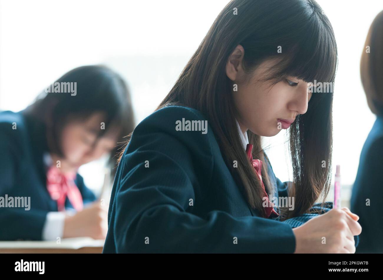 Female students taking a class in a classroom Stock Photo - Alamy