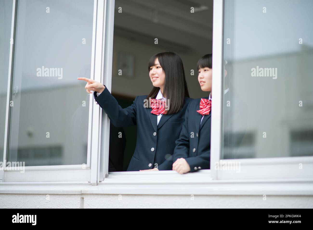 Female student looking outside in a classroom Stock Photo - Alamy