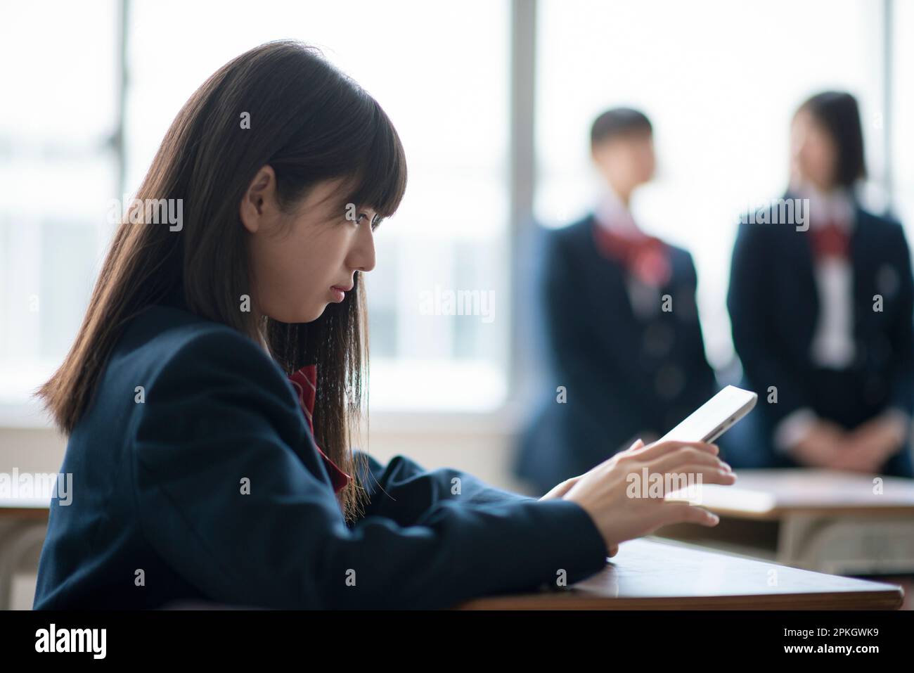 Female student operating a tablet PC in the classroom Stock Photo - Alamy