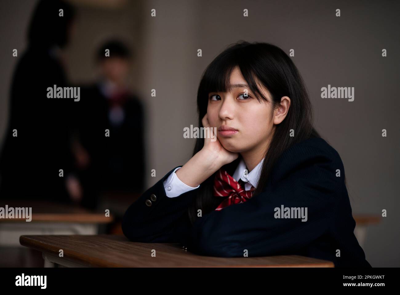 Female student thinking in the classroom Stock Photo - Alamy