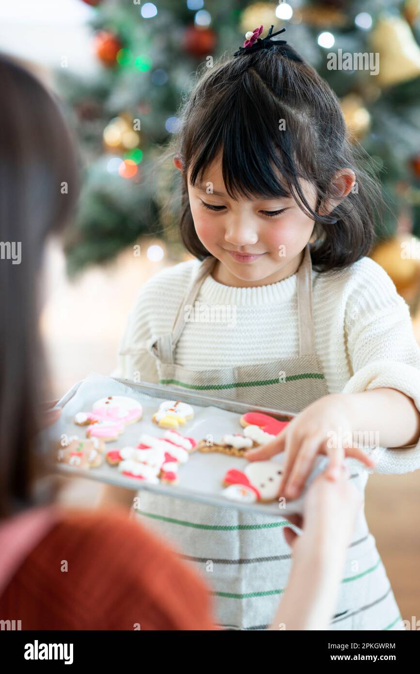 Smiling girl with icing cookies Stock Photo - Alamy