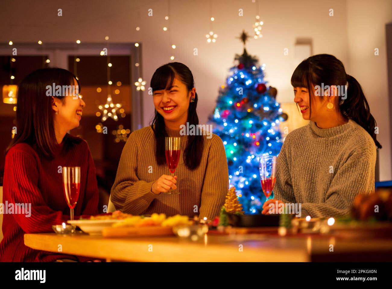 Woman chatting at a Christmas party Stock Photo - Alamy
